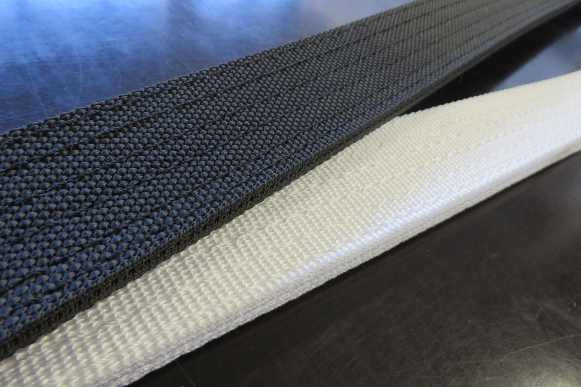 Wear belts for vacuum boxes
