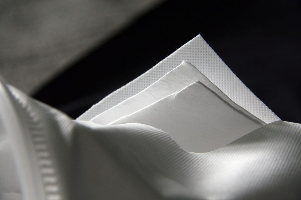 Filter bags for industrial filtration of liquids